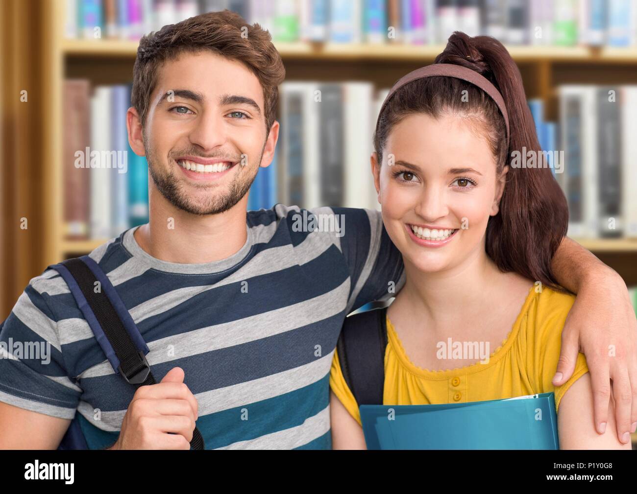 Student couple in education library Stock Photo - Alamy