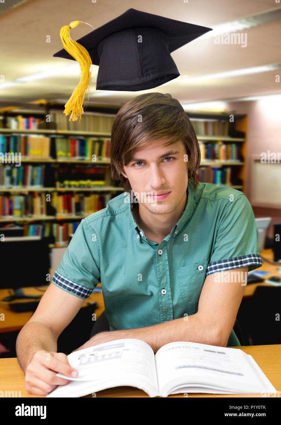 Student man in education library with graduation hat Stock Photo - Alamy