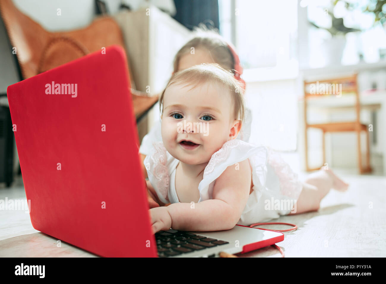 Child looking at screen of notebook hi-res stock photography and images ...