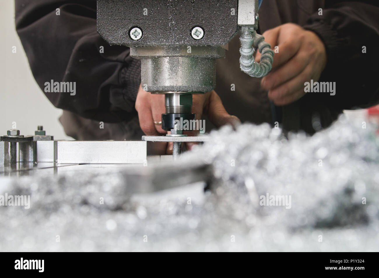 Worker male hands working on the production factory of lathes Stock ...