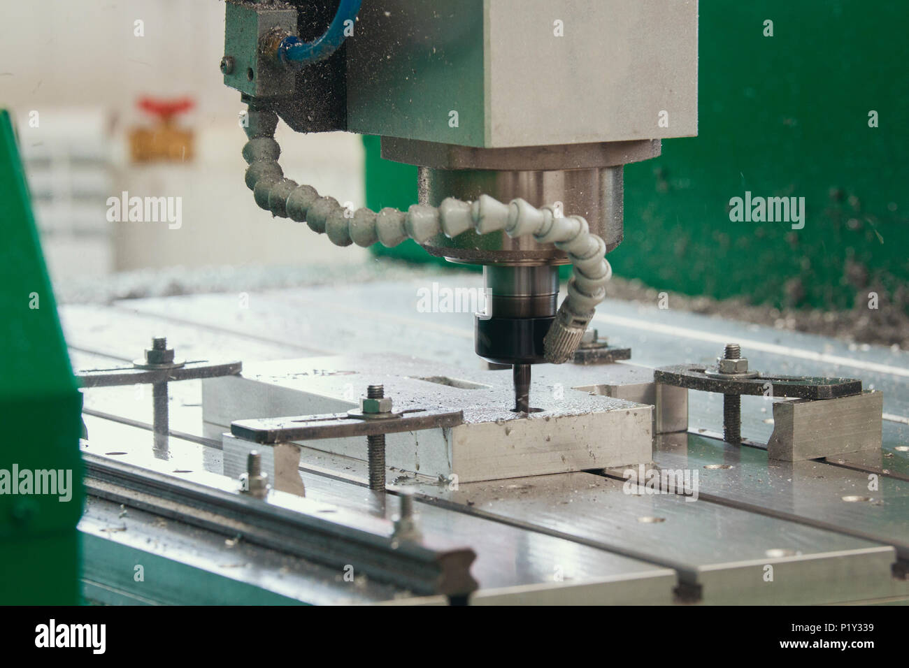 Processing of metal parts with CNC machine at factory with lathes Stock ...