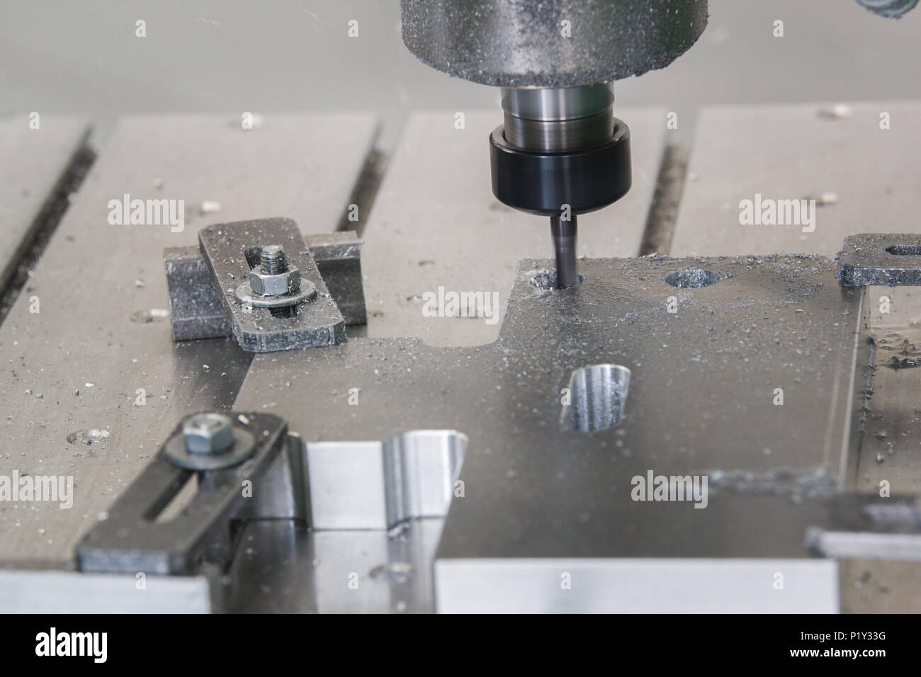 Process drilling of metal detail for production CNC machine at factory ...