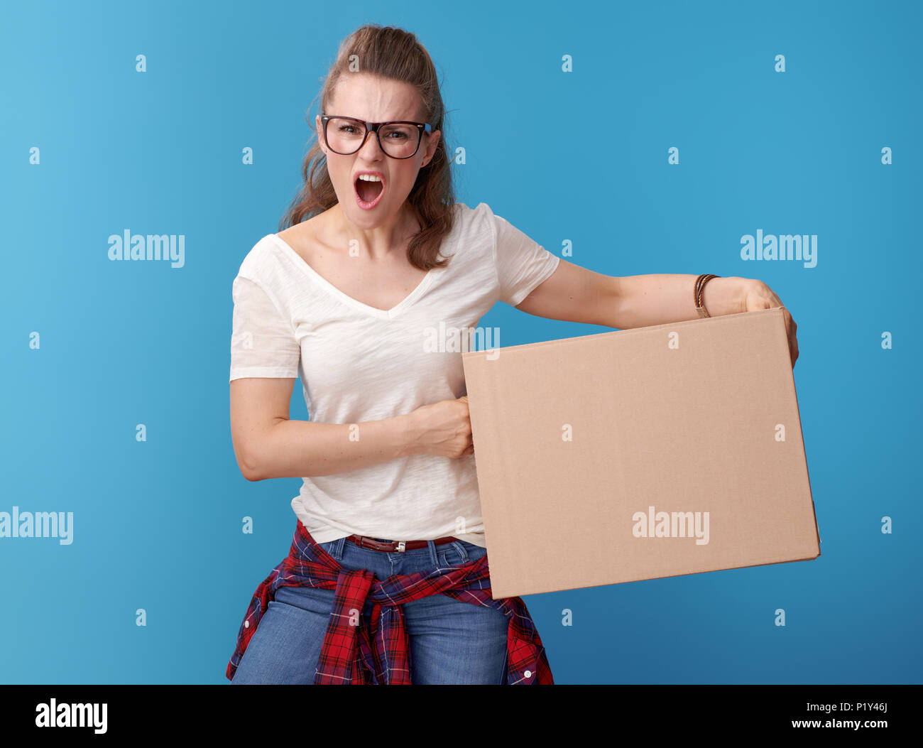 Sad woman packing boxes hi-res stock photography and images - Alamy
