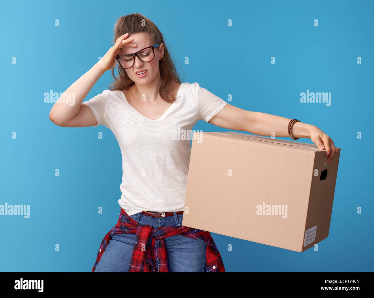 Sad woman packing boxes hi-res stock photography and images - Alamy