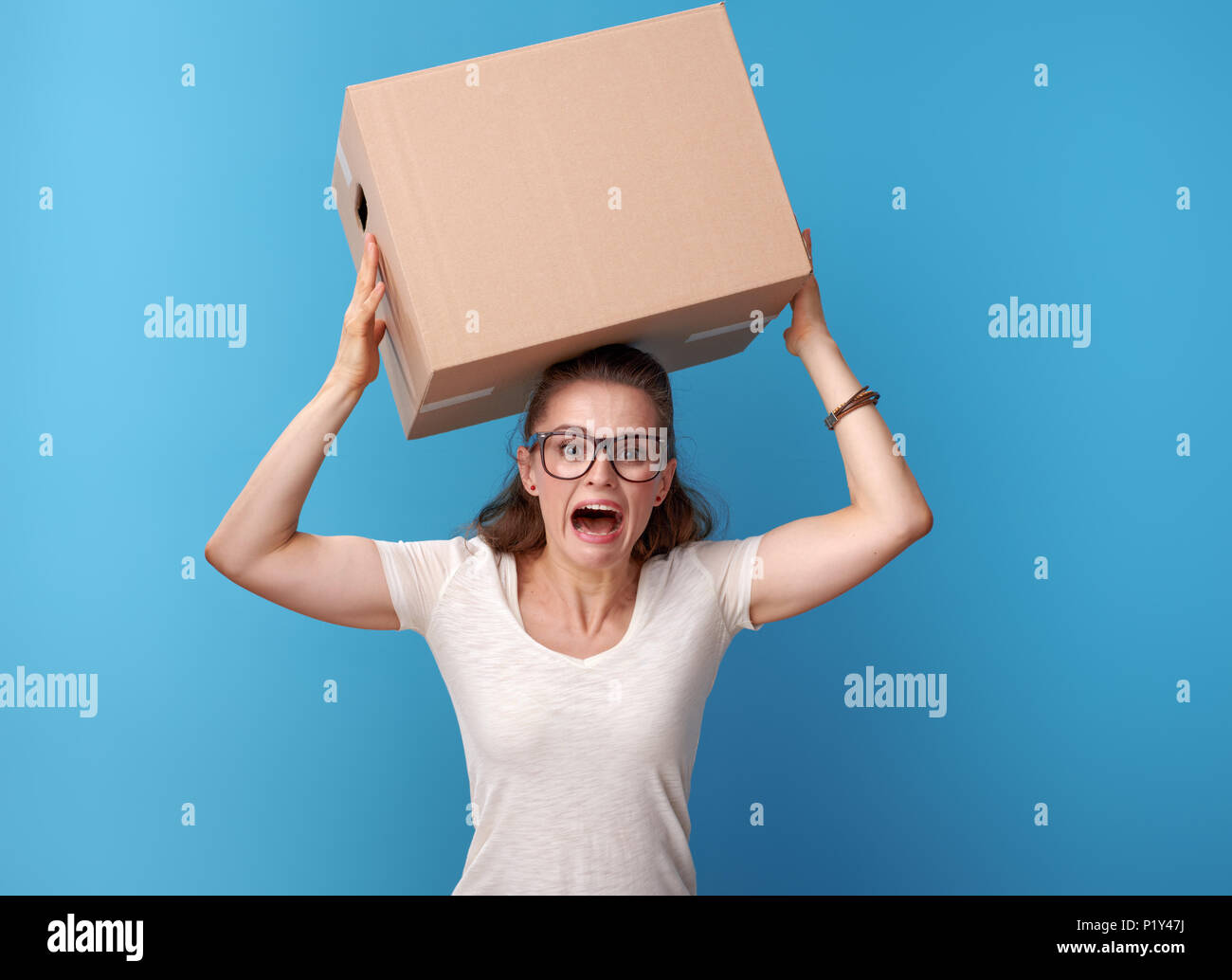 Sad woman packing boxes hi-res stock photography and images - Alamy