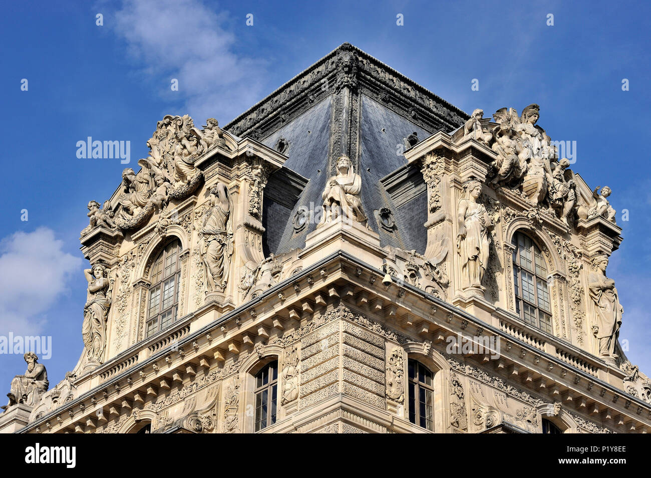 France, Paris, Louvre Palace, detail of a rooftop with sculpted windows ...