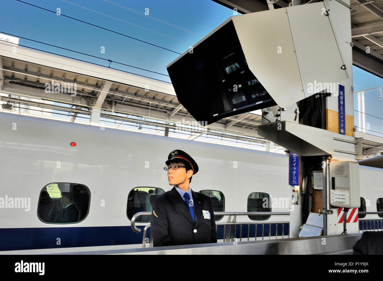 Japan, Okayama, station master of the Shinkansen high-speed railway ...