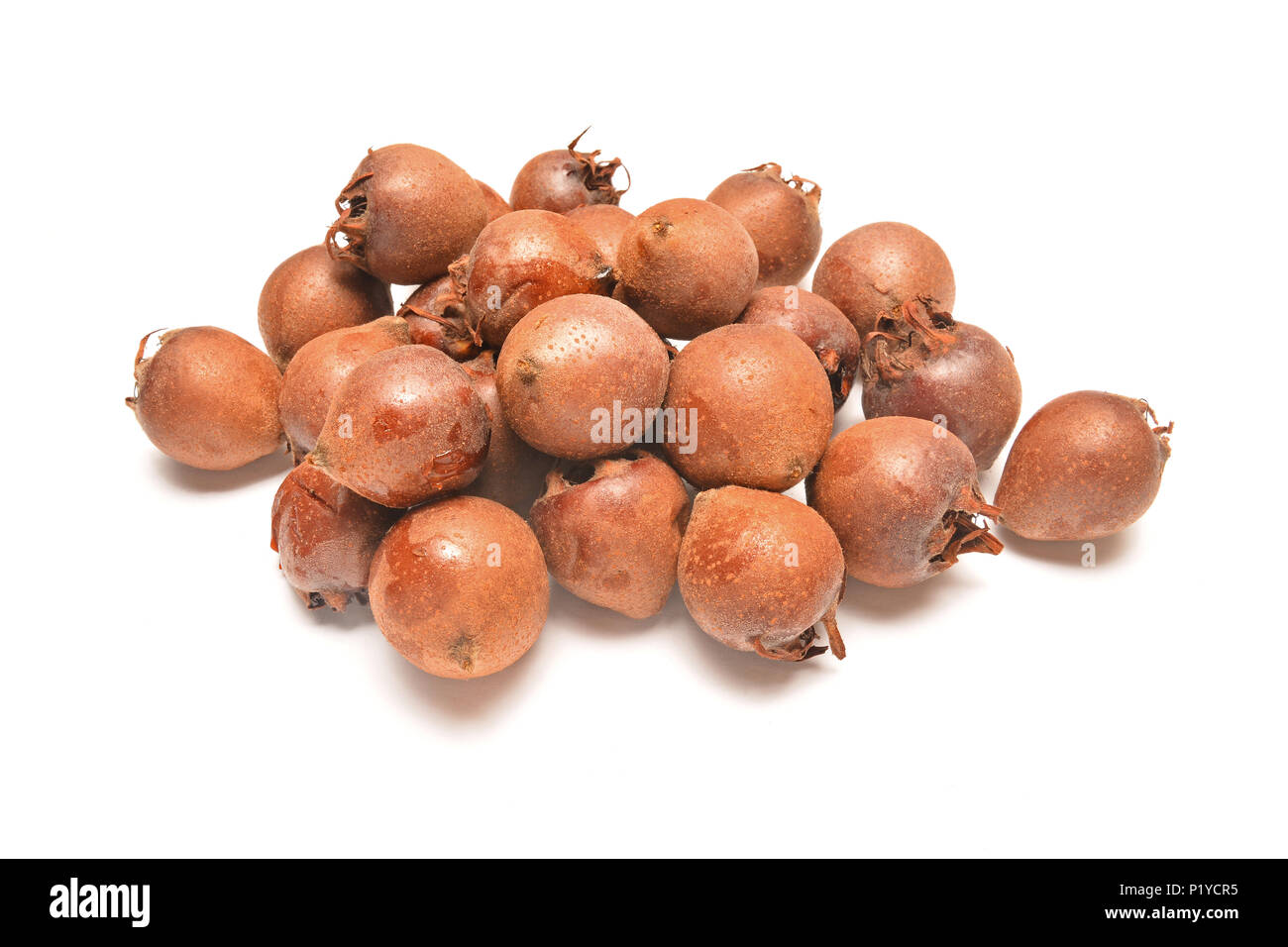 medlar fruits isolated on white Stock Photo - Alamy