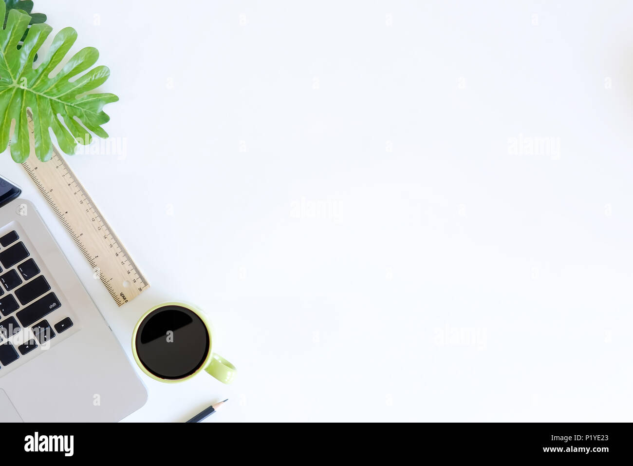 Office desk workspace laptop computer, ruler, pencil and coffee cup top ...