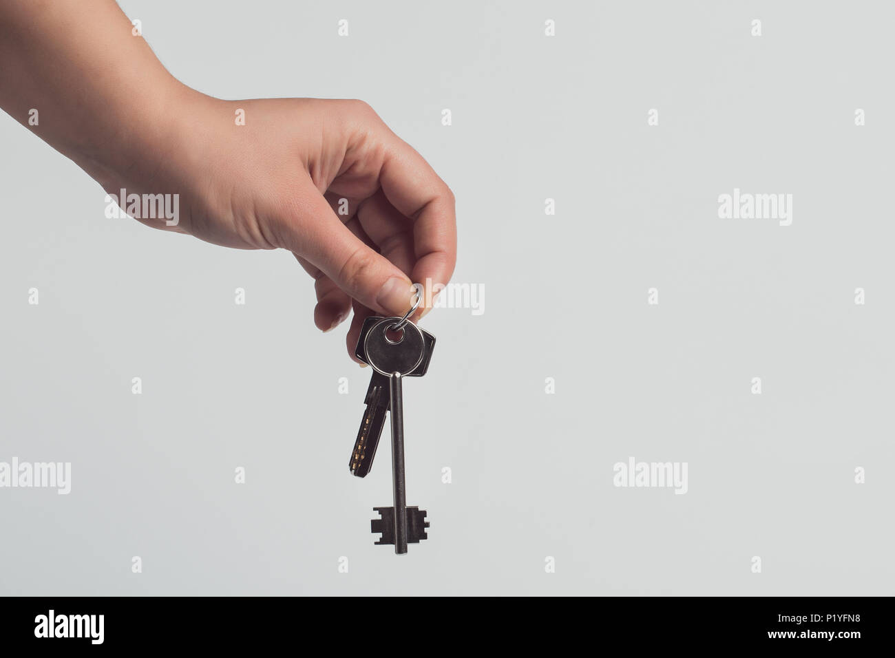 keys in hand isolated on white background, toned image Stock Photo - Alamy