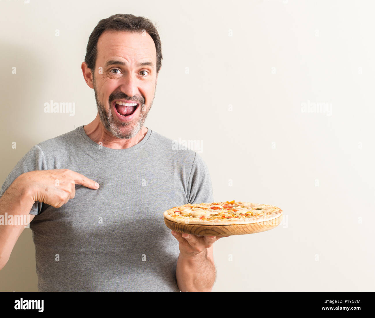 Man pointing at pizza hi-res stock photography and images - Alamy