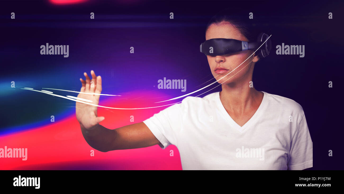 Beautiful woman gesturing while using virtual video glasses Stock Photo ...