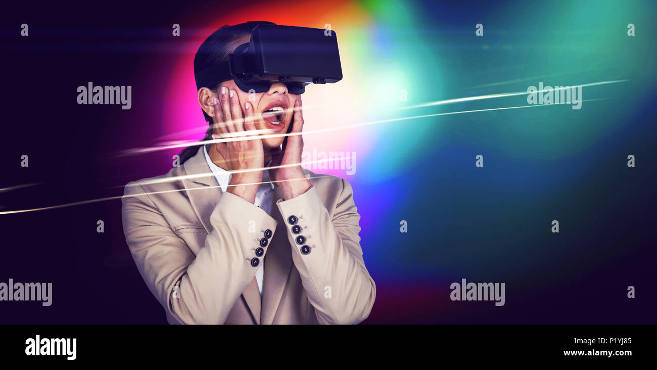 Surprised businesswoman wearing virtual video glasses Stock Photo - Alamy