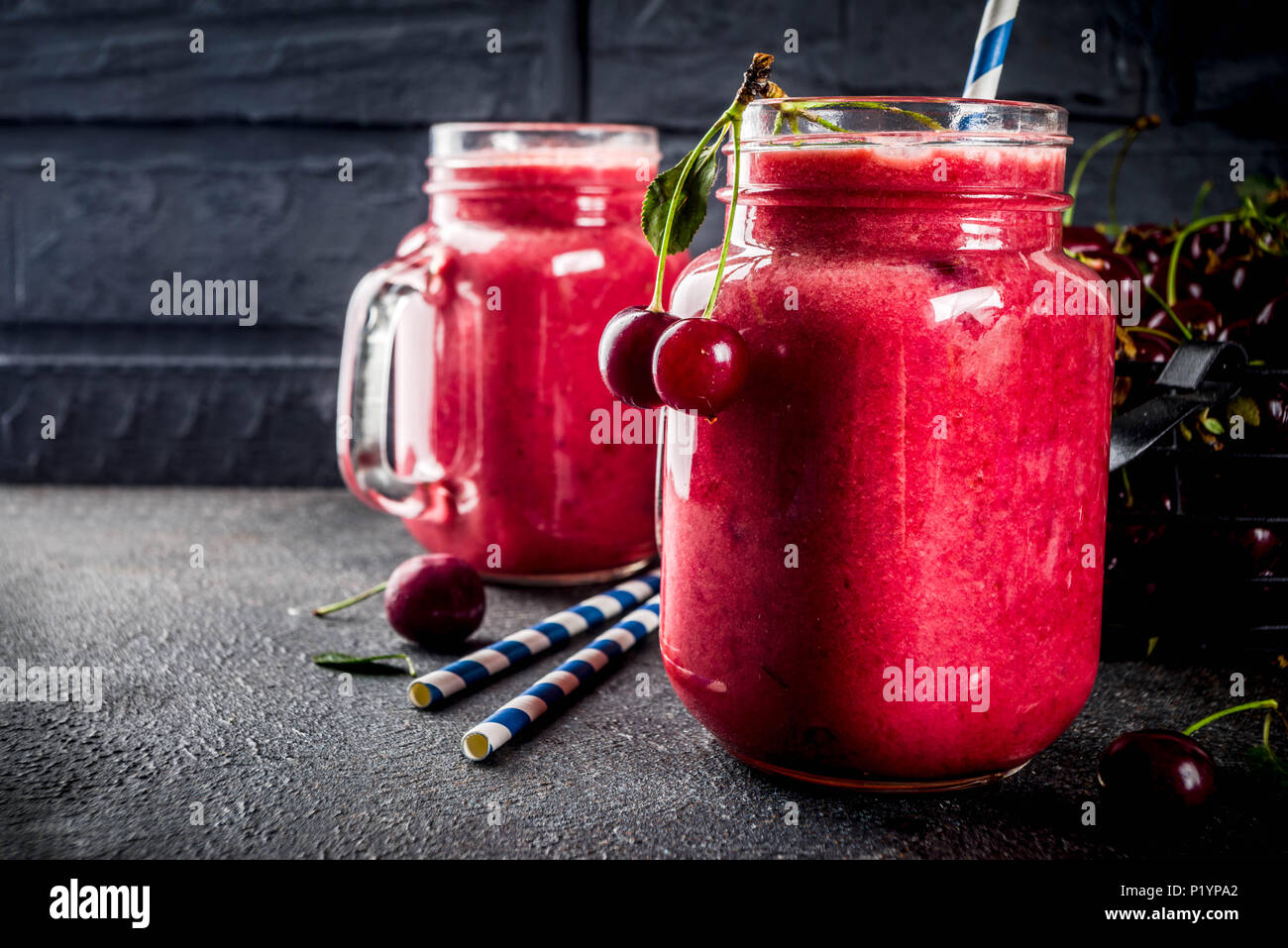 Summer fruity vitamin drink. homemade cherry smoothie on dark ...
