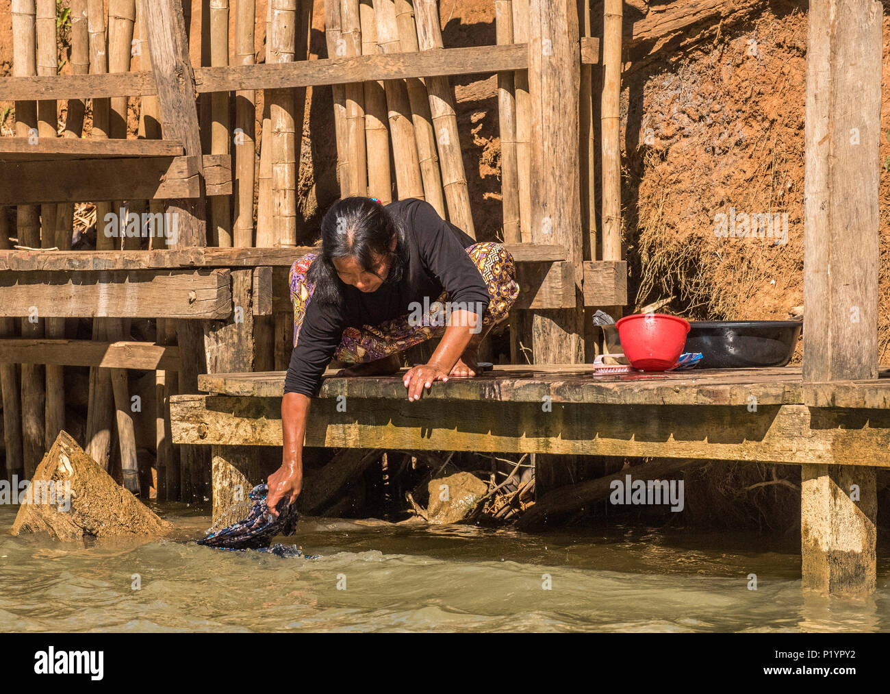 Myanmar, Shan State, Lake Inle, doing the laundry on the shore of the ...