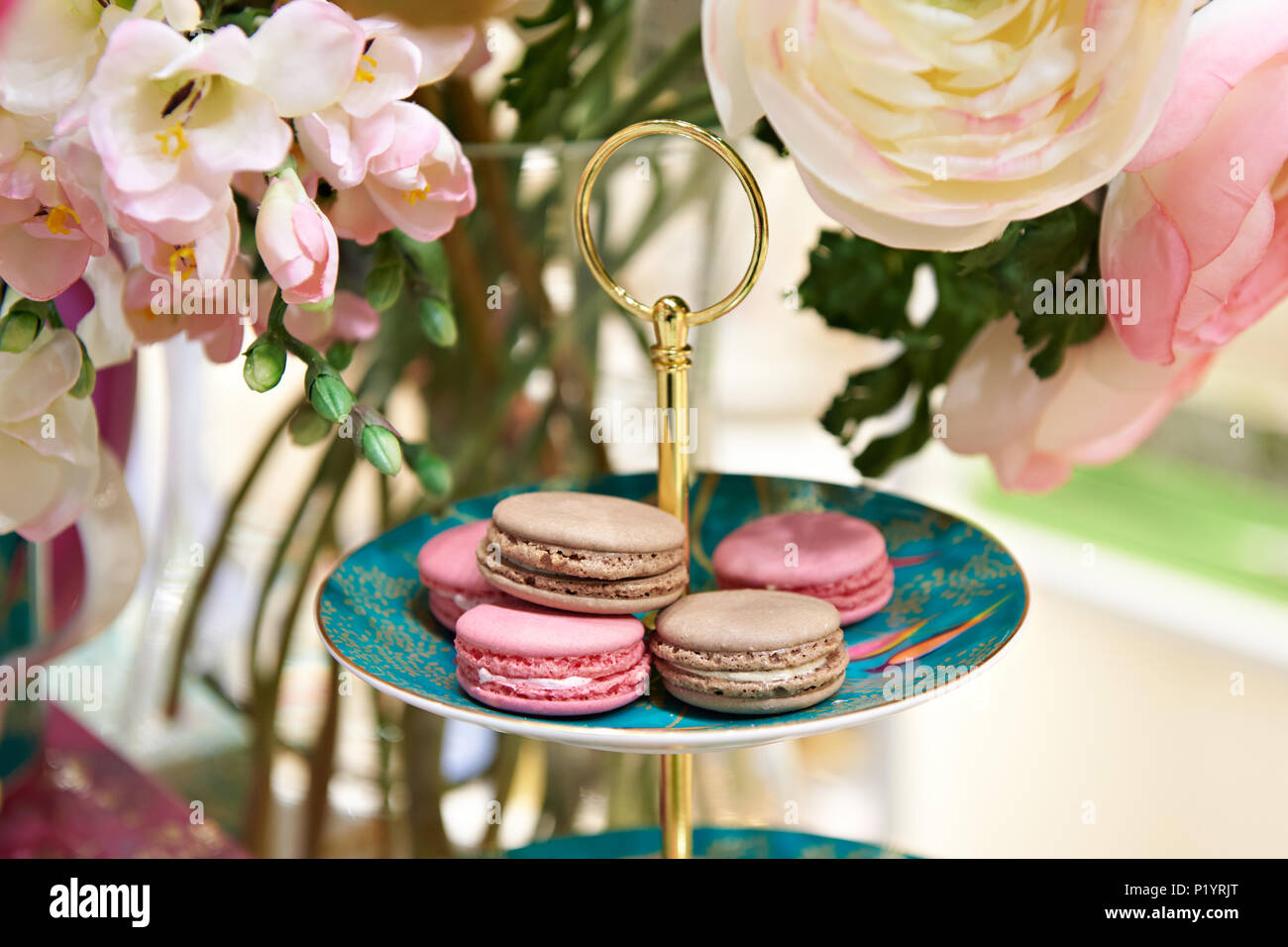 Beautiful still life with macaron biscuits and flowers Stock Photo - Alamy