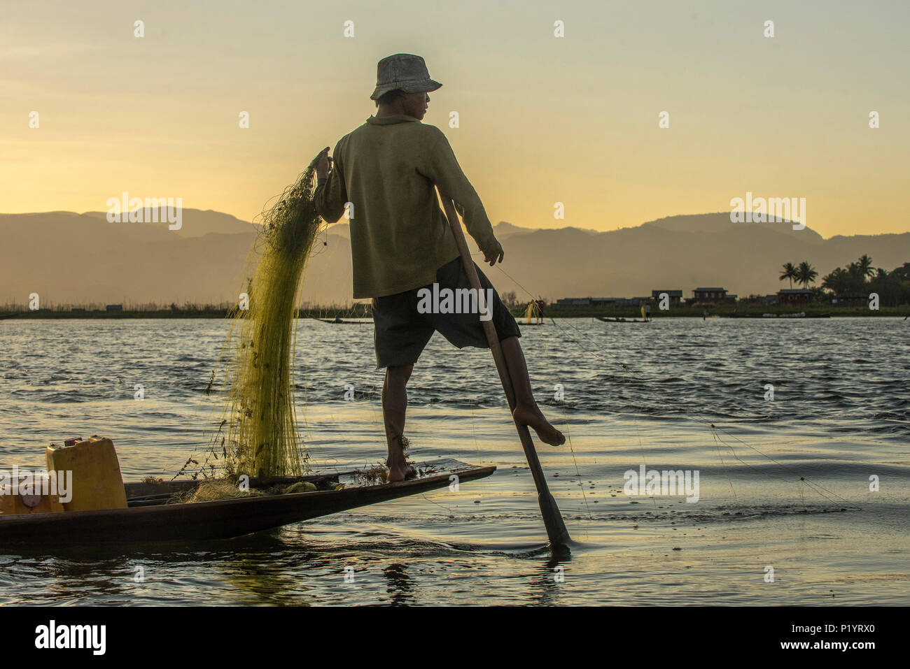 Myanmar, Shan region, lake Inle, fisherman in a dugout Stock Photo - Alamy