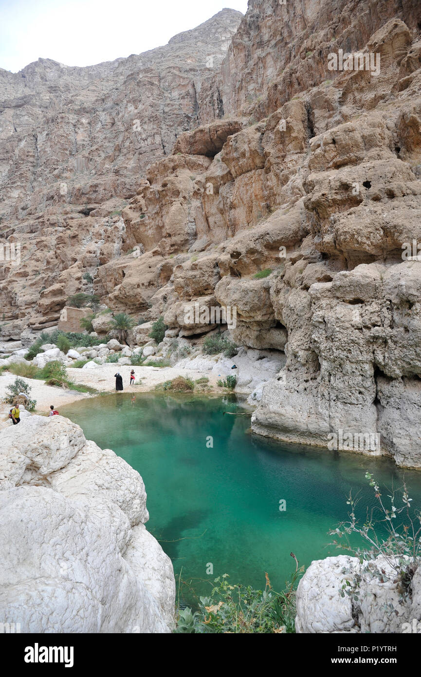 Sultanate of Oman, Wadi Shab, turquoise blue waters gorge surounded by ...
