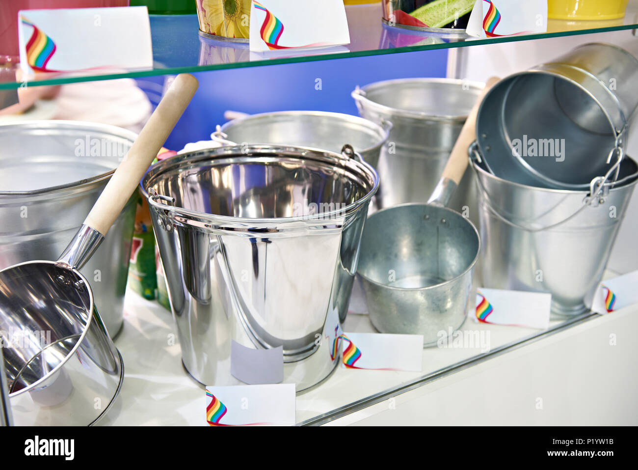 Metal galvanized buckets and kovshs on the counter in the store Stock ...