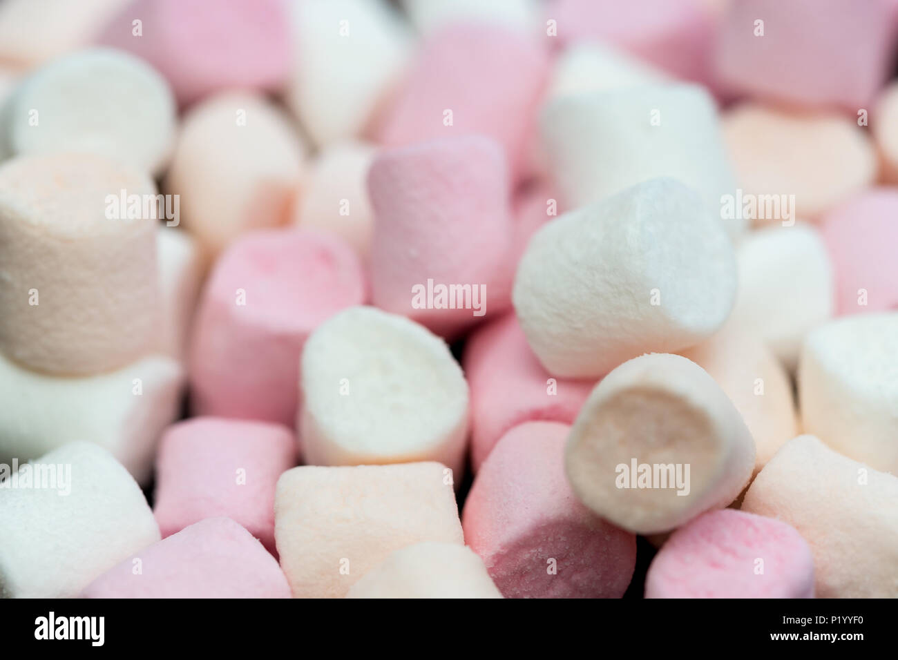 Marshmallow candy sweets pink food background Stock Photo - Alamy