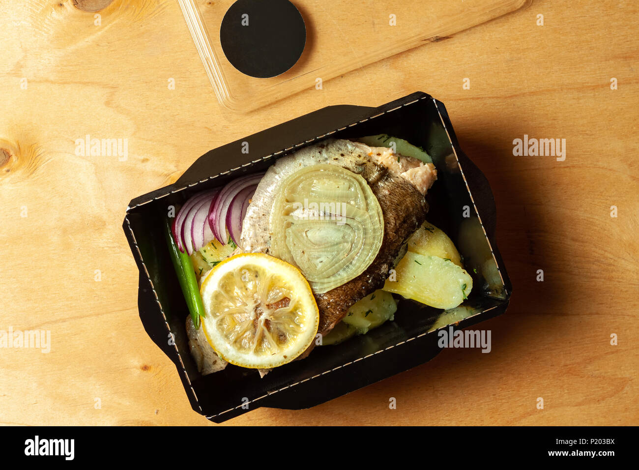 Fish fillet with vegetables and spices in a cardboard box Stock Photo ...
