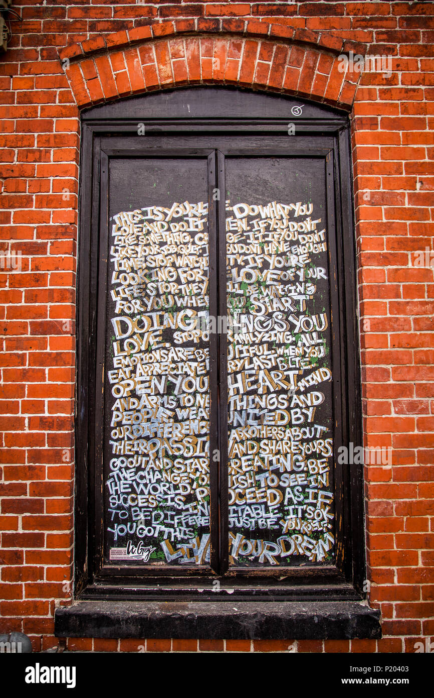 Graffiti art on a window in Savannah Stock Photo - Alamy