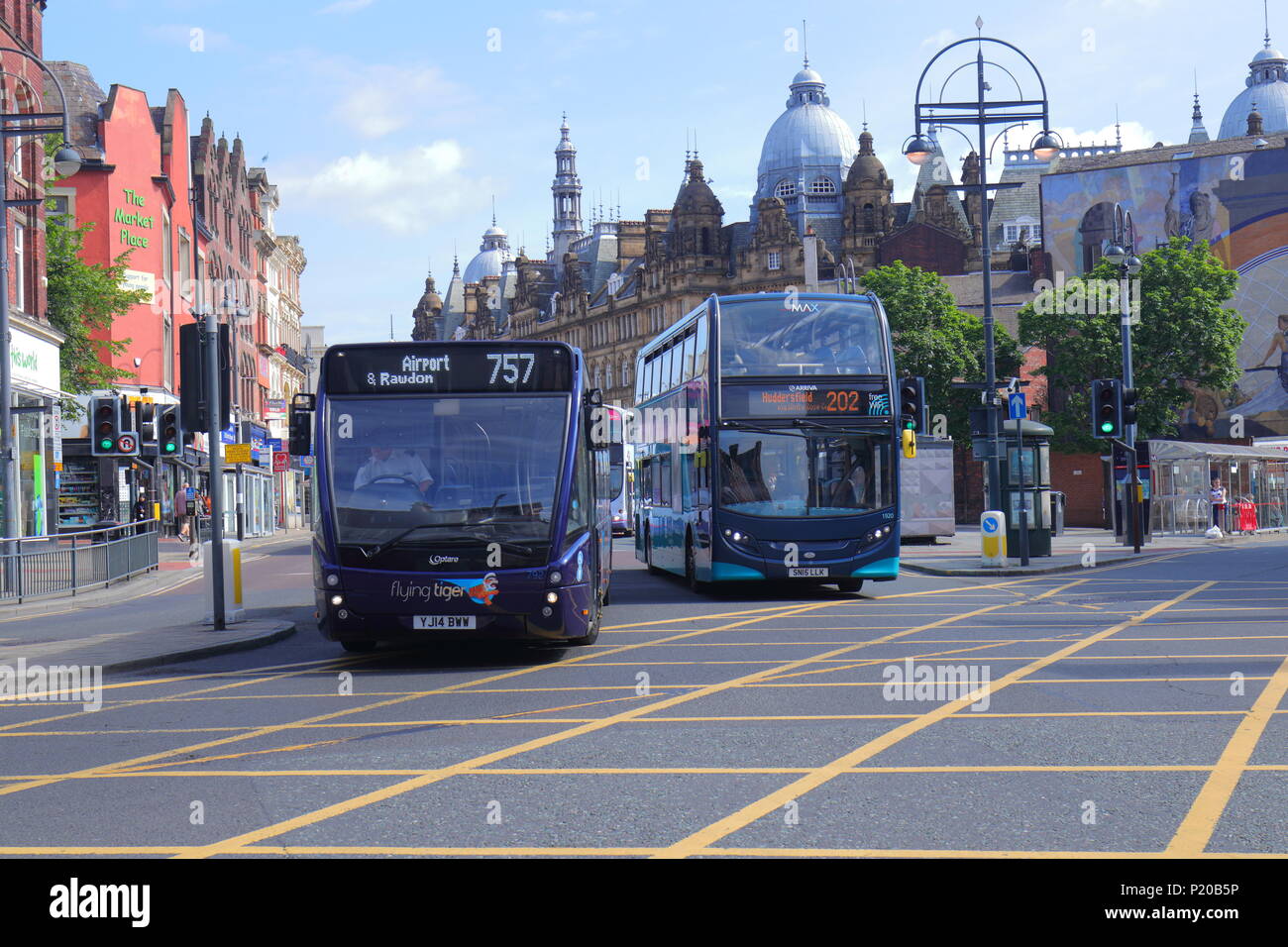 Buses heading along New Market Street in Leeds City Centre Stock Photo ...