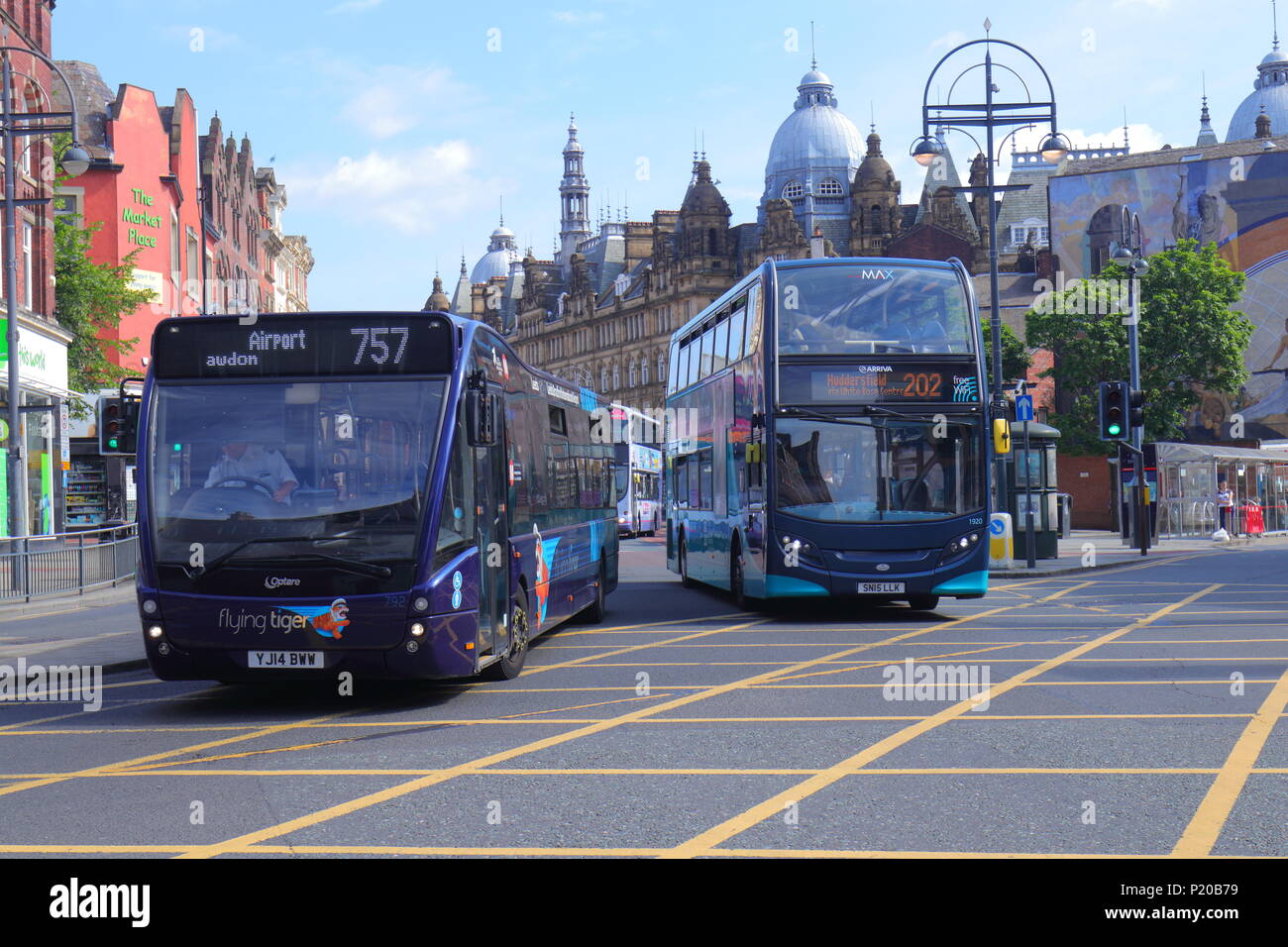 Buses heading along New Market Street in Leeds City Centre Stock Photo ...