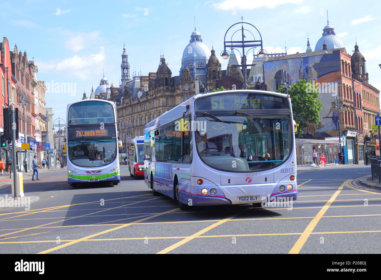 Buses from the First Bus Company drive along New Market Street in Leeds ...