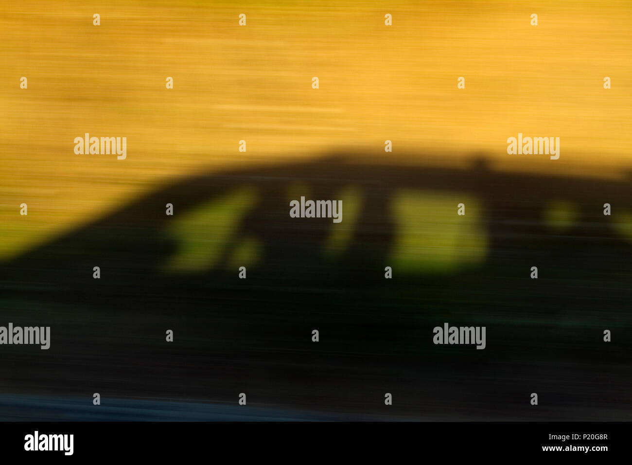 Shadow of a car driving in the country Stock Photo - Alamy