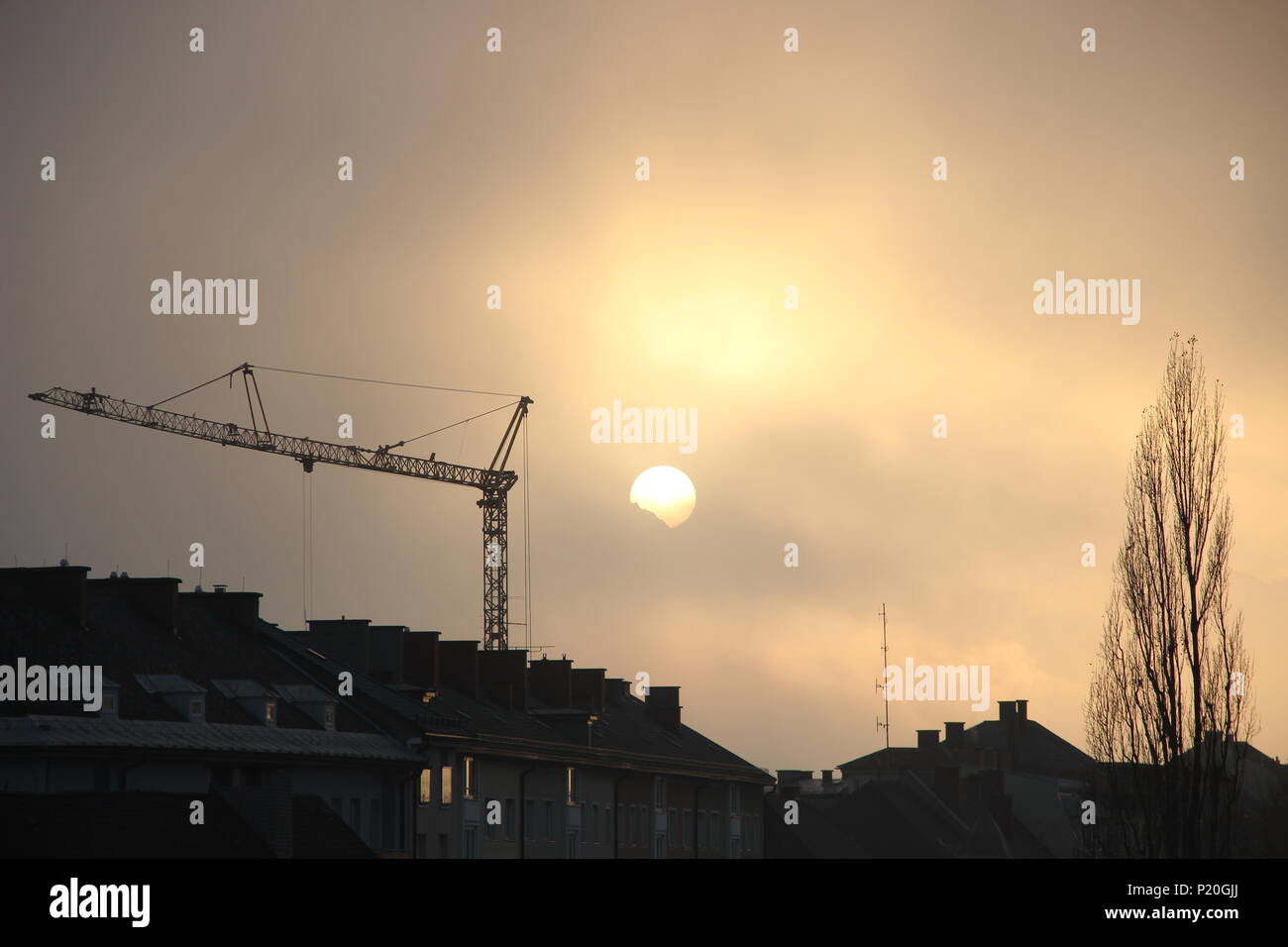 Construction crane photographed in the sunset, Klagenfurt, AUT Stock ...