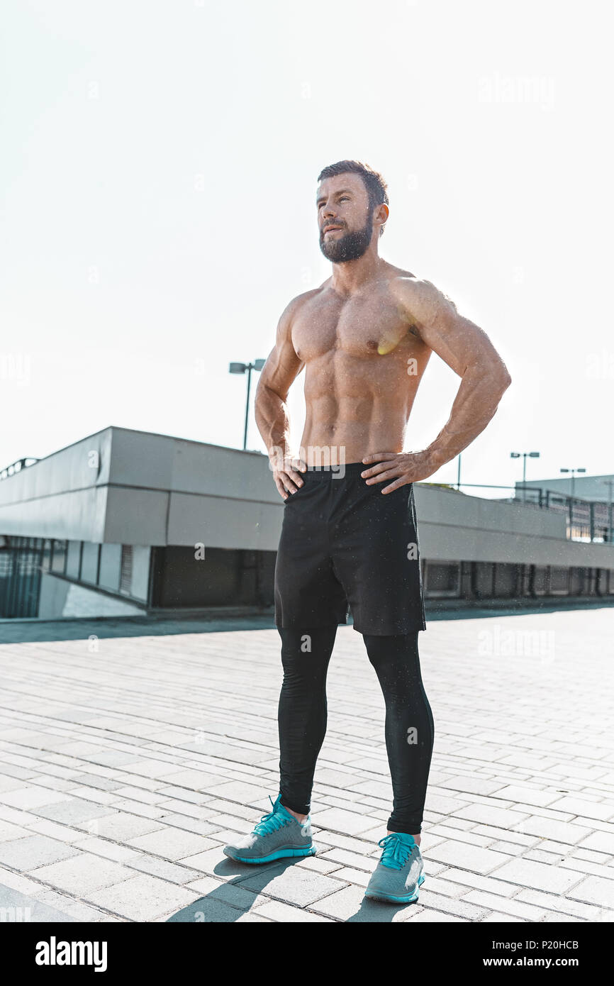 Fit fitness man posing at city Stock Photo - Alamy