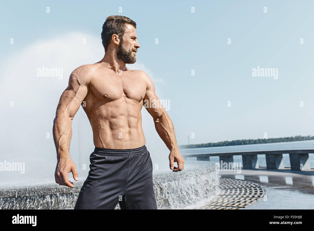 Fit fitness man posing at city Stock Photo - Alamy
