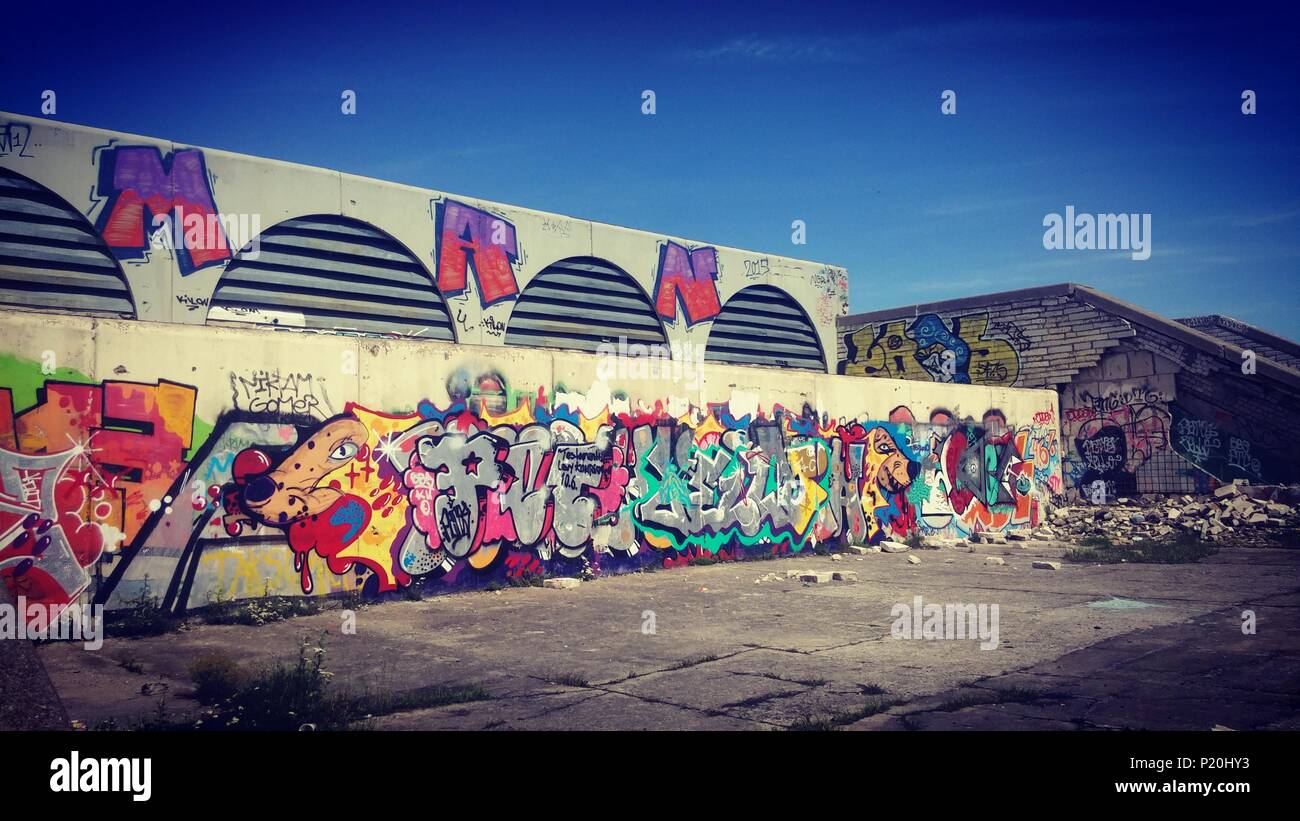 Graffiti wall on old factory Stock Photo - Alamy