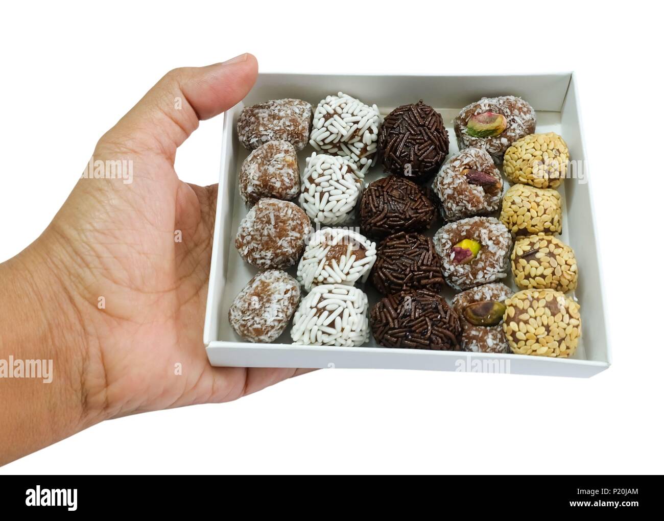 Sweet Food, Hand Holding Assorted Round Chocolate Candy Balls or ...