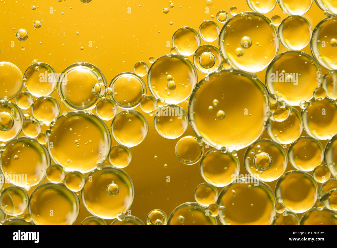 golden yellow bubble oil, abstract background Stock Photo - Alamy