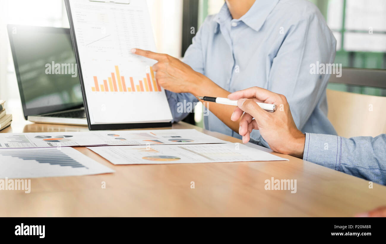 Business team hands at working with plan on office desk and modern ...