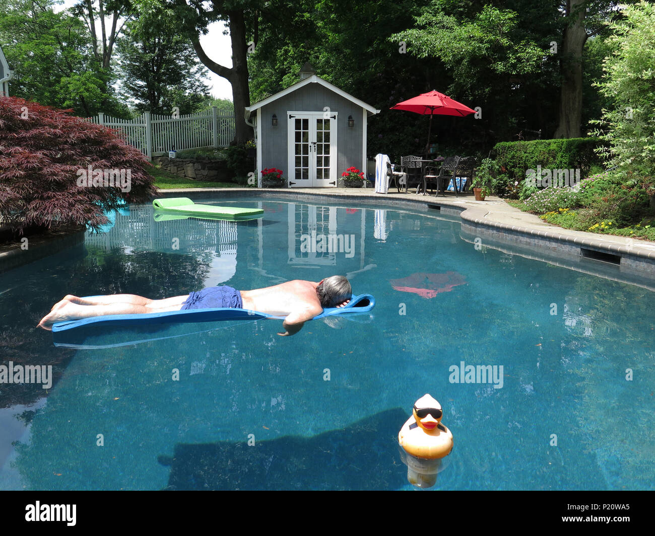 relaxing in the swimming-pool Stock Photo - Alamy
