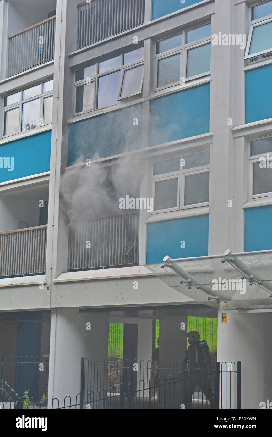 Bristol, UK. Block of flats on fire seen with smoke pouring out at ...