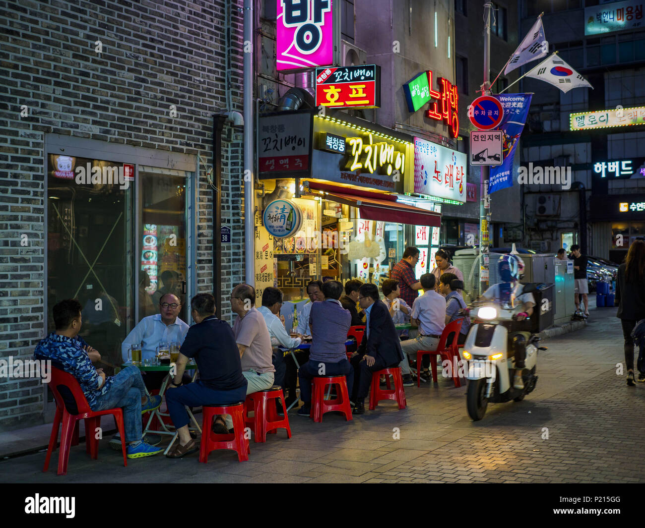 Several men sit hi-res stock photography and images - Alamy