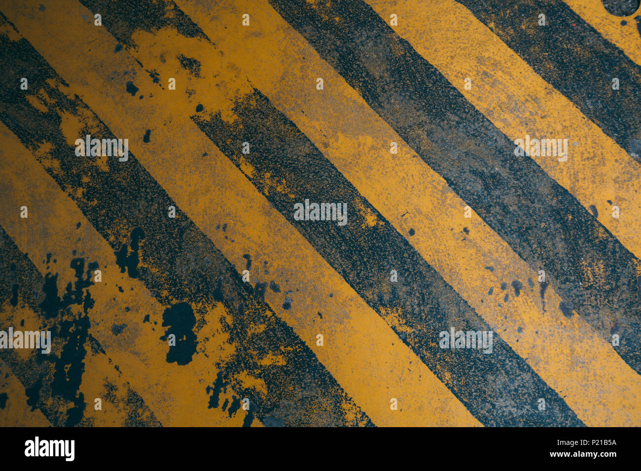 Dirty yellow diagonal warning lines background for construction danger ...