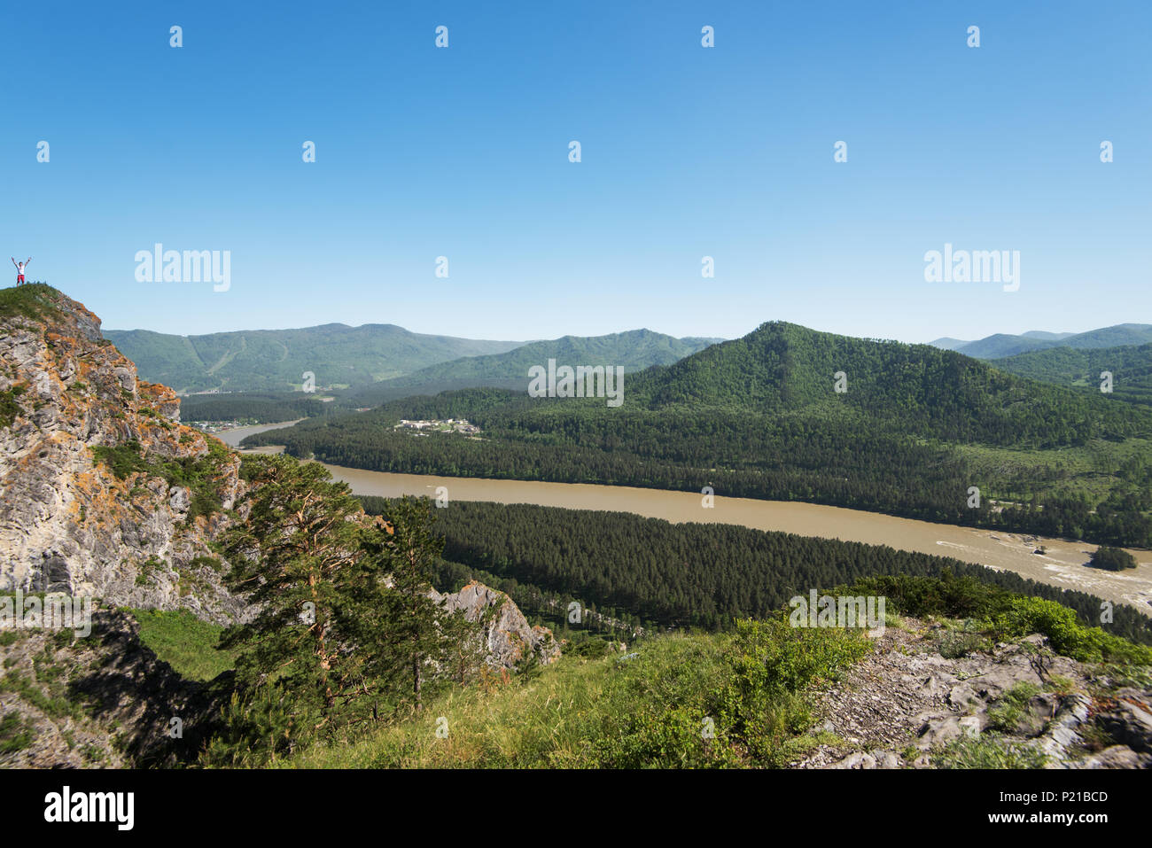 Man standing on top of cliff Stock Photo - Alamy