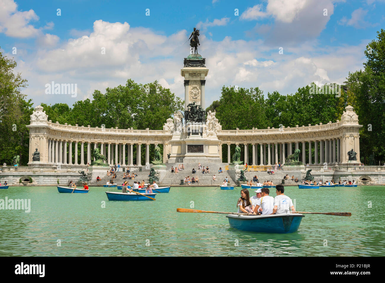 Madrid park Retiro, view on a summer afternoon of young people taking a ...