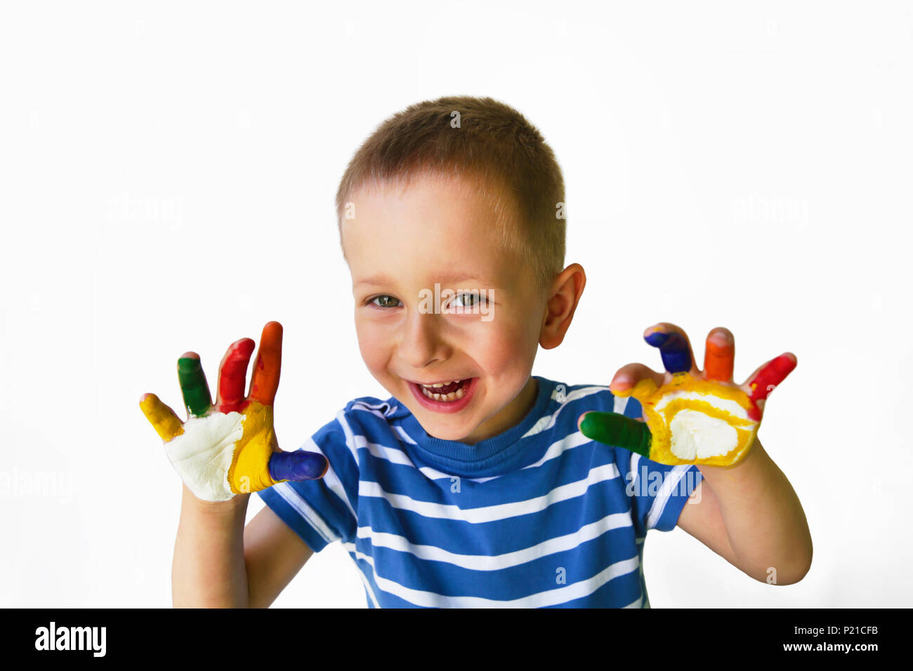 Cute little boy with painted hands Stock Photo - Alamy