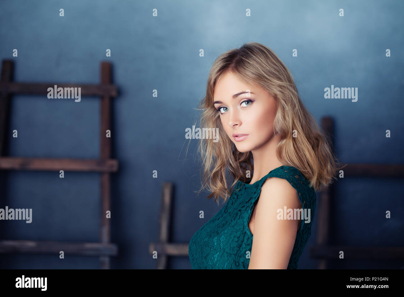 Nice fashion model woman on rustic background Stock Photo - Alamy