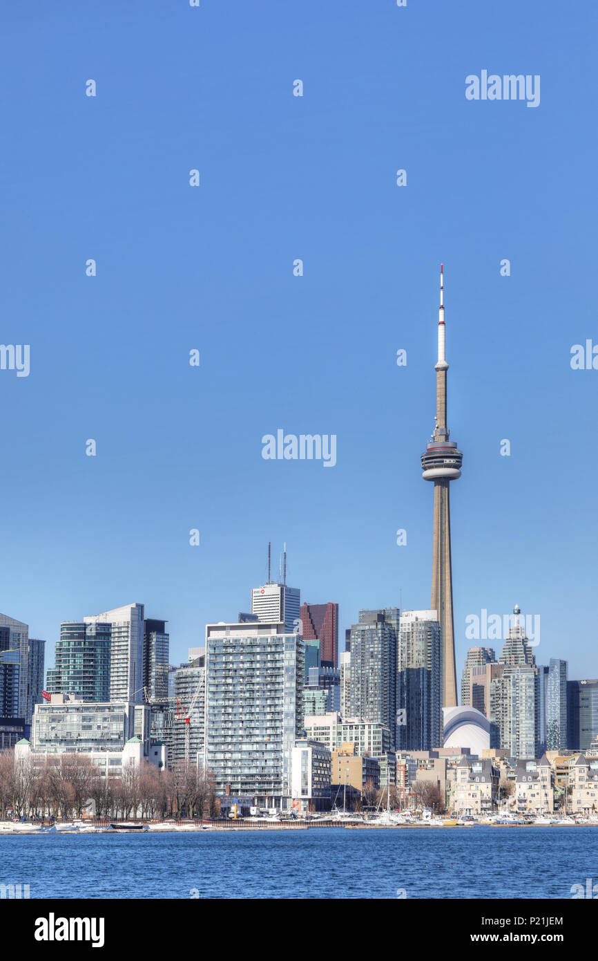 A Vertical of Toronto skyline across harbor on a sunny day Stock Photo ...