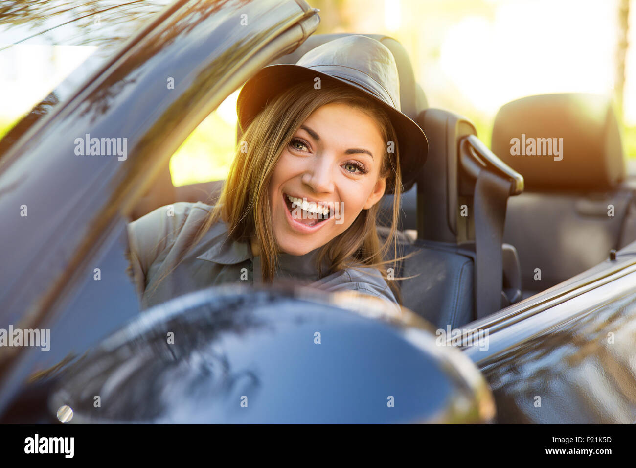 Lady driving convertible car top hi-res stock photography and images ...