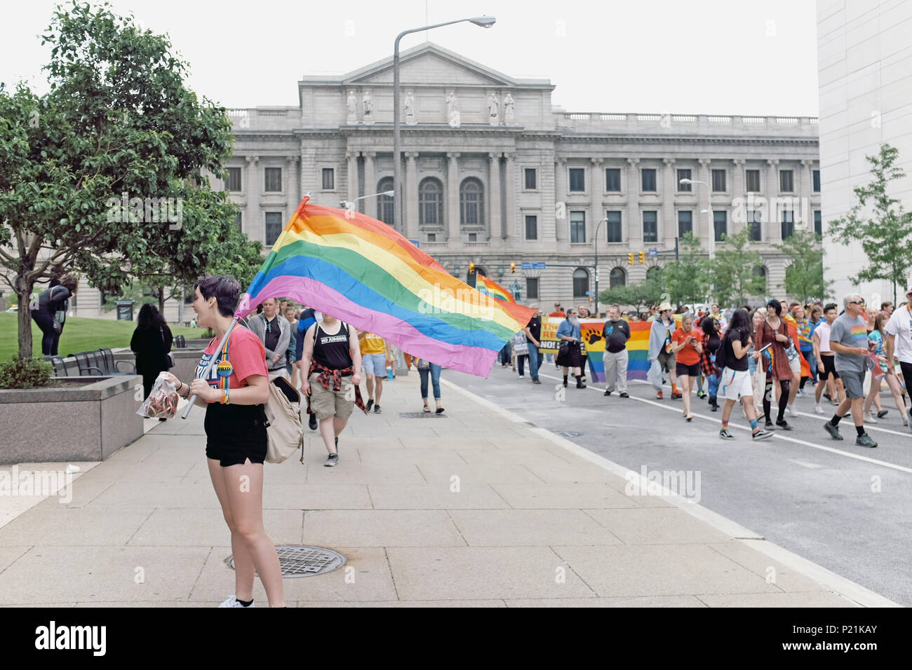 Millenial holding rainbow flag hi-res stock photography and images - Alamy