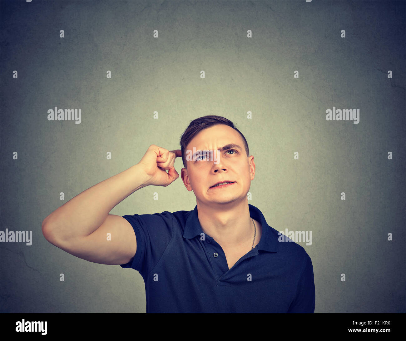 Closeup portrait man scratching head, thinking about something, looking ...