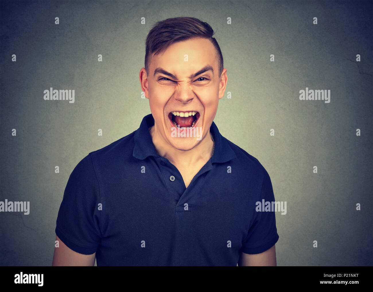portrait of young angry man screaming Stock Photo - Alamy